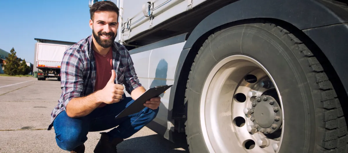 What is a tri-axle truck and trailer, and what is it used for?
